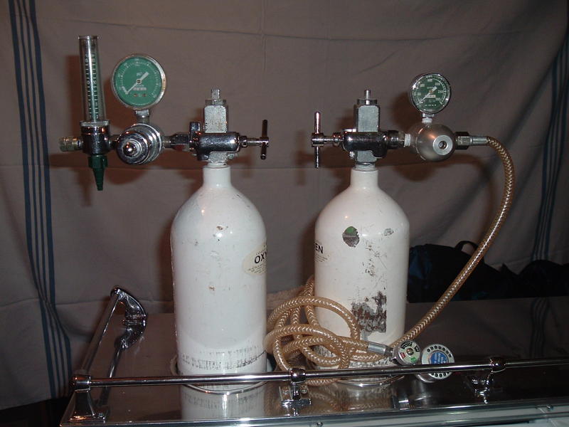 Float type oxygen regulator on the left and Positive Pressure device on ...
